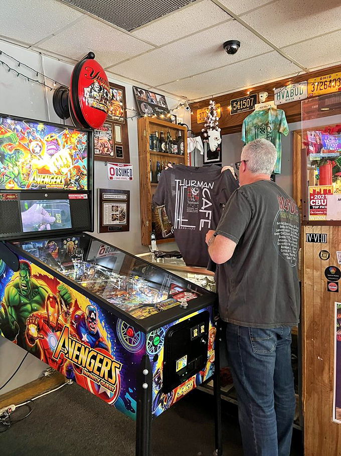 Between burger battles, patrons can test their skills at the Avengers pinball machine, where saving the universe seems easier than finishing a Thurmanator.