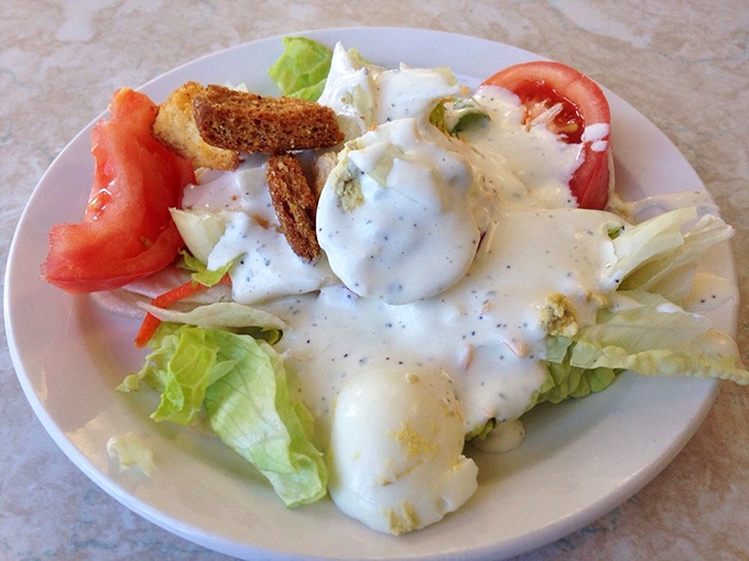 A garden salad that proves vegetables can have personality too. Those croutons look like they've been working out.