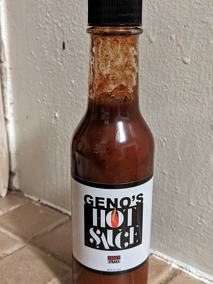 The hot sauce bottle stands ready for those who believe that greatness can always be improved upon with a dash of heat.