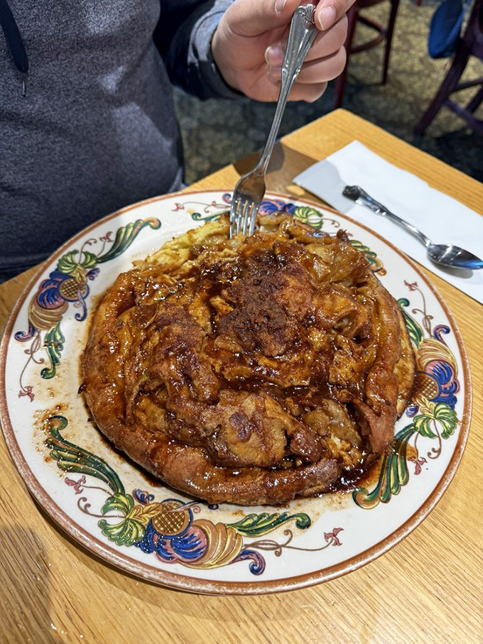 The German apple pancake arrives like breakfast performance art&mdash;a gravity-defying puff of cinnamon-scented glory that's worth the 20-minute wait.