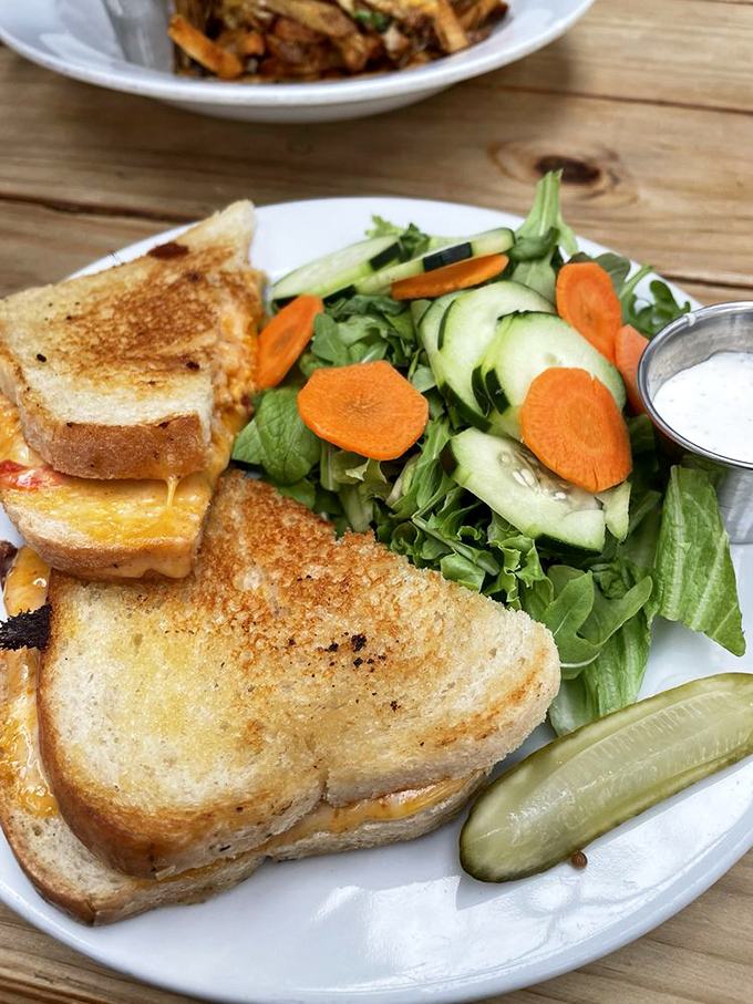The pimento cheese sandwich &ndash; grilled to golden perfection with melty, spreadable Southern p&acirc;t&eacute; inside &ndash; plays beautifully with its fresh garden companion.