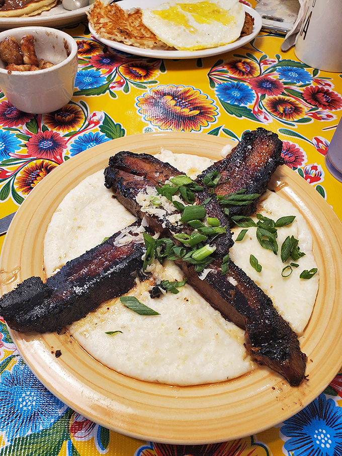 Grits topped with bacon that's been kissed by fire and blessed with green onions. Southern comfort that speaks with a Kansas accent.