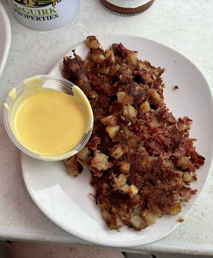 The legendary Goat Hash&mdash;a beautiful mess of potatoes and corned beef with cheese sauce standing by. Hangover cure or celebration feast? Yes.