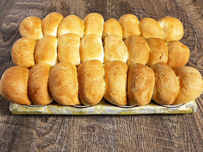 The famous hot rolls in their natural habitat&mdash;golden, fluffy, and ready for their airborne journey across the dining room into your waiting hands.