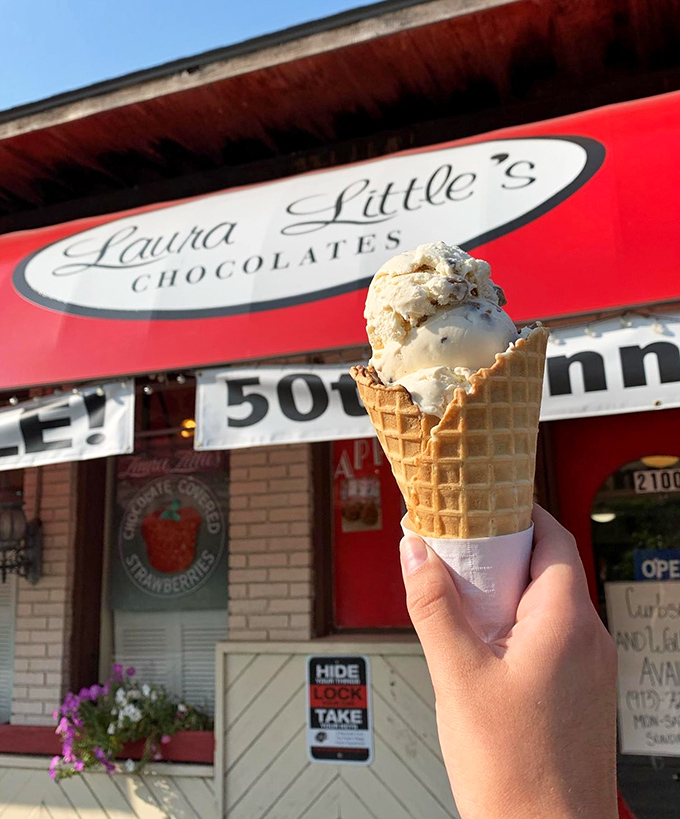 A hand-held ice cream cone against the shop's iconic red awning&mdash;summer's perfect accessory and the only fashion statement that melts in the sun.