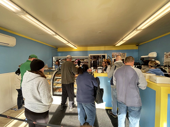 The blue and yellow interior might be simple, but the line of customers speaks volumes about what matters most here.