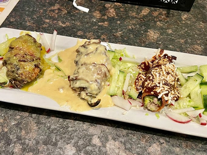 This artistic plate showcases three distinct personalities&mdash;one smothered in cheese, one wrapped in green, one dusted with spice. The flavor trifecta.