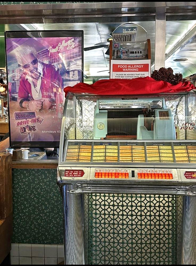 The vintage "Kicker-Catcher" game machine, where kids once spent their allowance while waiting for burgers, still holding court in the corner.