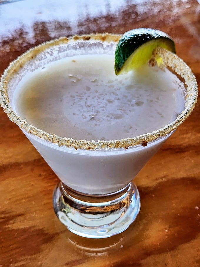 A key lime martini with a sugared rim is basically dessert in a glass. The lime garnish is just showing off at this point.