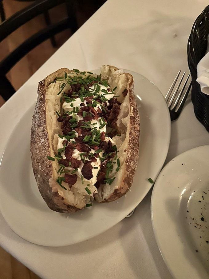 A loaded baked potato that's dressed for the occasion&mdash;bacon bits playing the role of delicious confetti at this spud celebration.