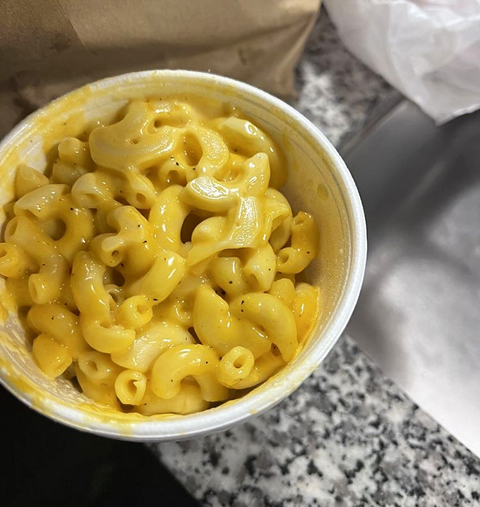 Mac and cheese: where comfort food meets strategic planning. Nothing tames chicken heat like this golden pool of cheesy goodness.