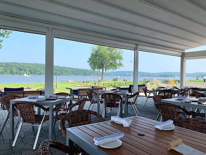 Riverside views and comfortable wicker chairs create a relaxing setting for you to enjoy a meal by the peaceful water.