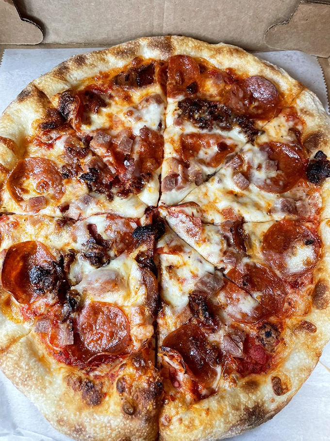 This isn't just pizza&mdash;it's a meat lover's manifesto written in cheese and pepperoni. That charred, bubbly crust is what dreams are made of.