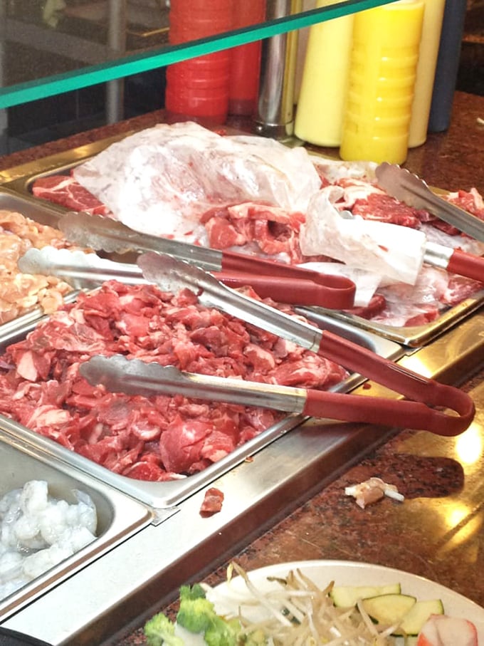 The raw ingredients awaiting their hibachi transformation. Like actors in the wings, these meats are about to become stars.
