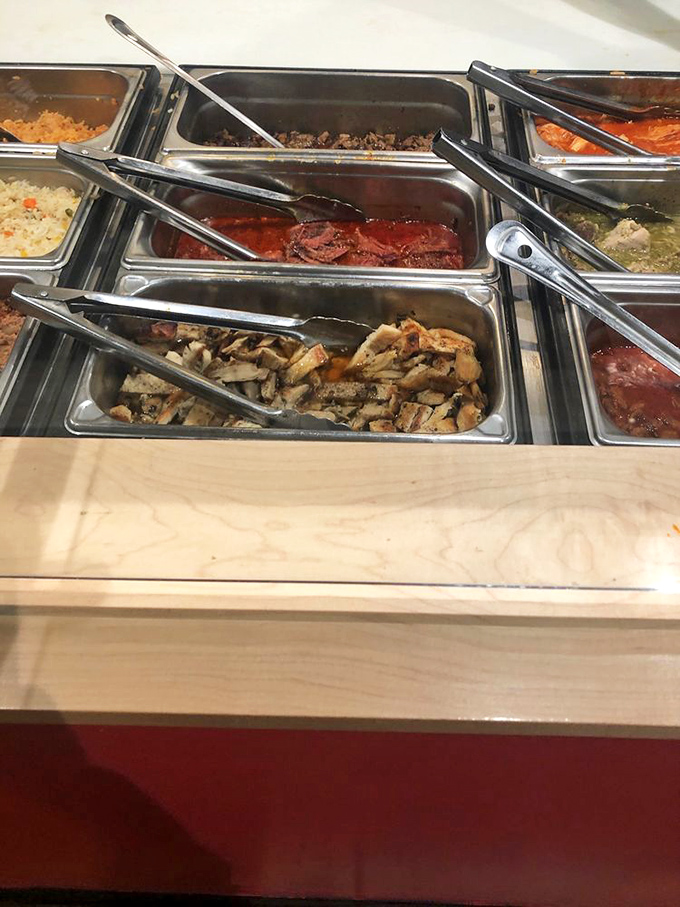The buffet line of meats and sauces&mdash;where decisions get tough and "I'll take everything" becomes a legitimate ordering strategy.