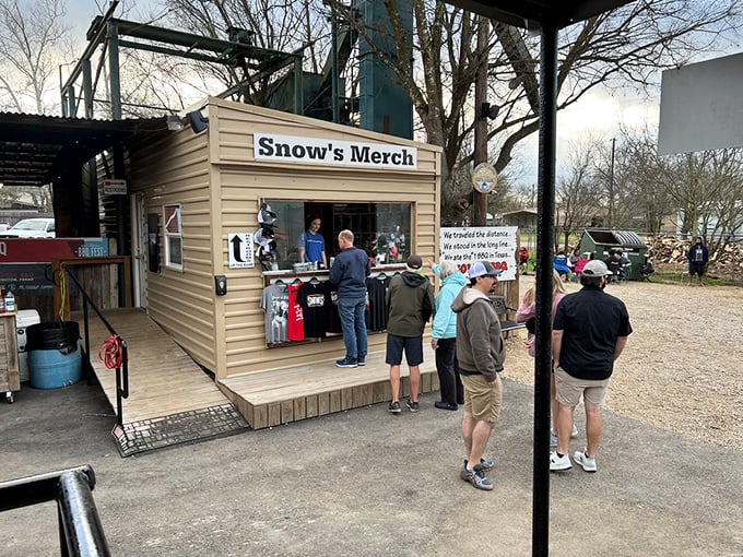 The merch stand proves barbecue isn't just a meal &ndash; it's a lifestyle worth broadcasting on your T-shirt, hat, and sauce-stained soul.