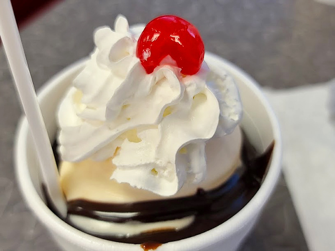 A hot fudge sundae topped with whipped cream and a cherry&mdash;dessert architecture that hasn't needed renovation since the Eisenhower administration.