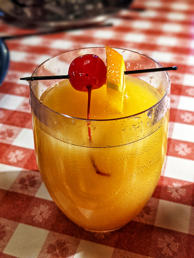 A mimosa with a cherry on top&mdash;because sometimes breakfast needs a little sparkle. It's not morning drinking; it's breakfast enhancing!