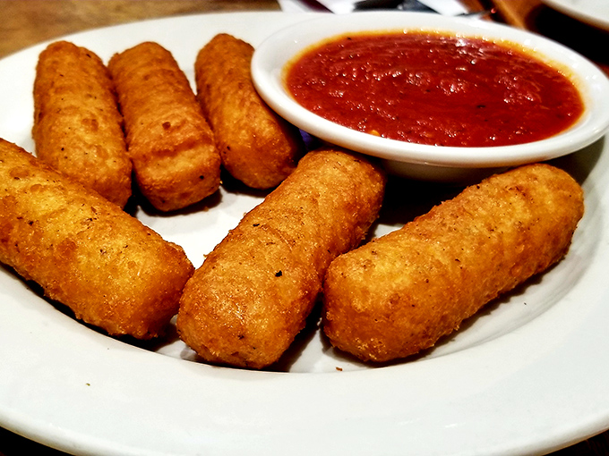 Mozzarella sticks: the universal language of appetizer joy. Crispy golden exterior, molten cheese interior, and marinara for dunking&mdash;perfection achieved.