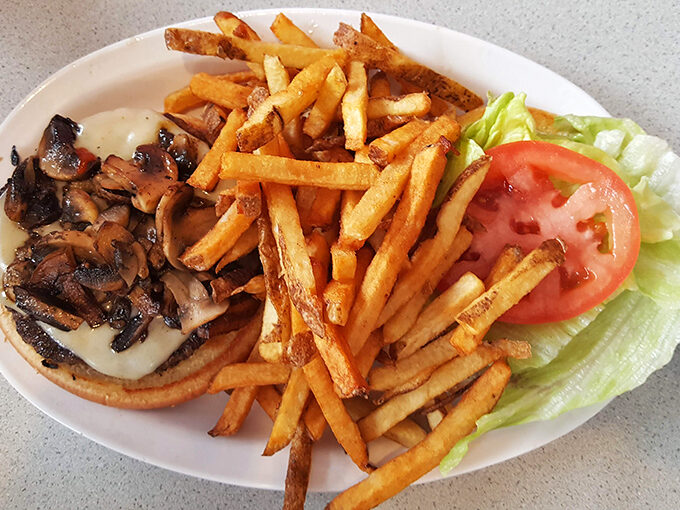 Mushrooms and Swiss cheese melting together atop a juicy patty &ndash; like a tasteful romance novel for your taste buds.