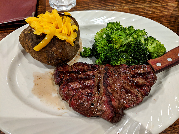 A New York strip with attitude alongside broccoli that actually wants to be eaten. That cheesy potato isn't playing a supporting role; it's gunning for the Oscar.