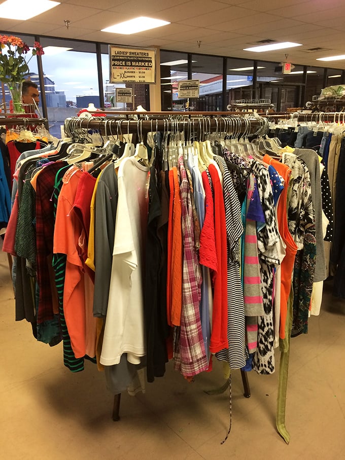 Ladies' sweaters organized with military precision. The color-coding alone deserves a standing ovation from Marie Kondo herself.