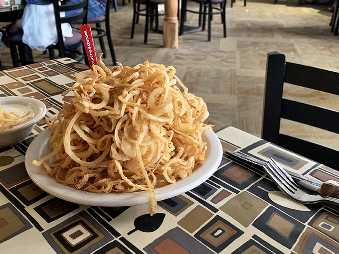 These aren't just onion rings; they're golden halos of crispy perfection stacked higher than Texas ambition.