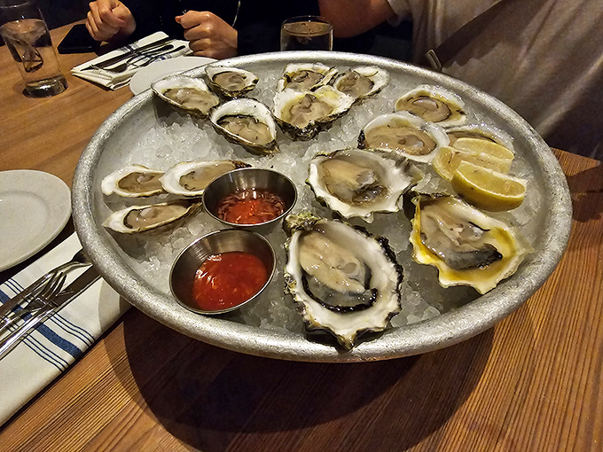 Fresh oysters on ice – nature's perfect appetizer. Each one tells a different briny story from a different coastal ZIP code.