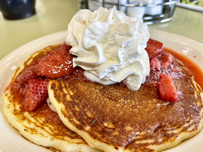 Pancakes that don't just sit there looking pretty&mdash;they perform. That whipped cream crown and strawberry jewels make breakfast royalty.