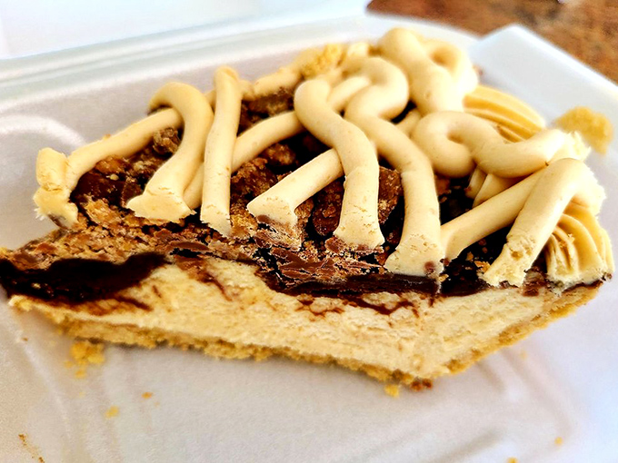 Peanut butter pie with decorative lattice that's basically childhood nostalgia in sophisticated form. The peanut butter-chocolate combo remains humanity's greatest diplomatic achievement.