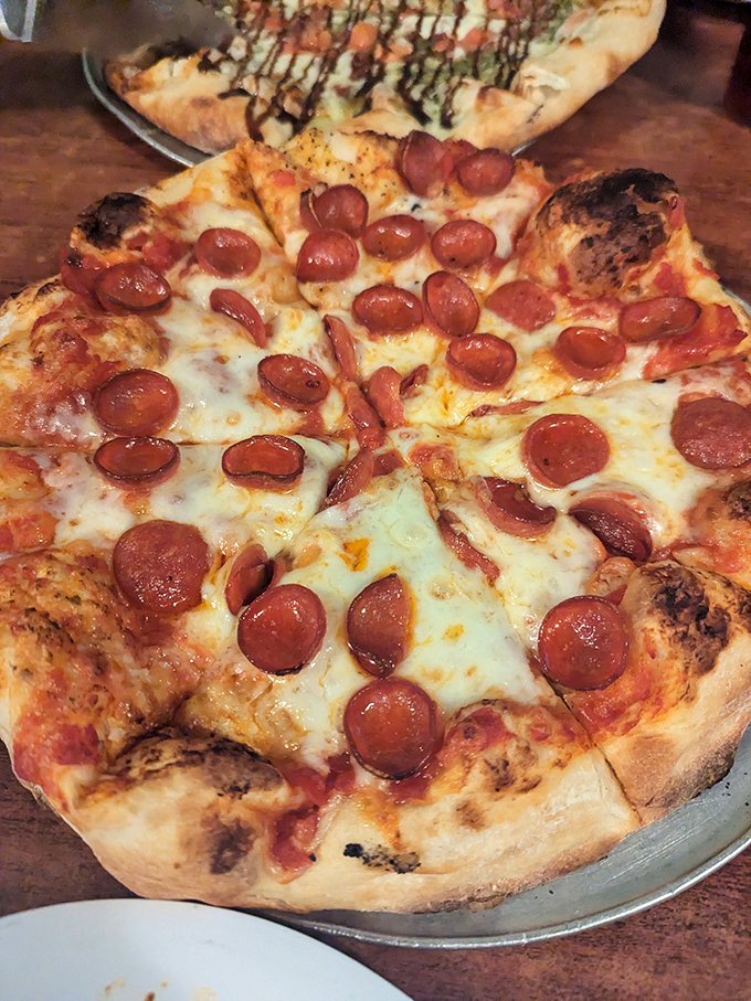 The close-up that launched a thousand road trips. Those perfectly curled pepperoni edges are nature's way of saying "I love you."