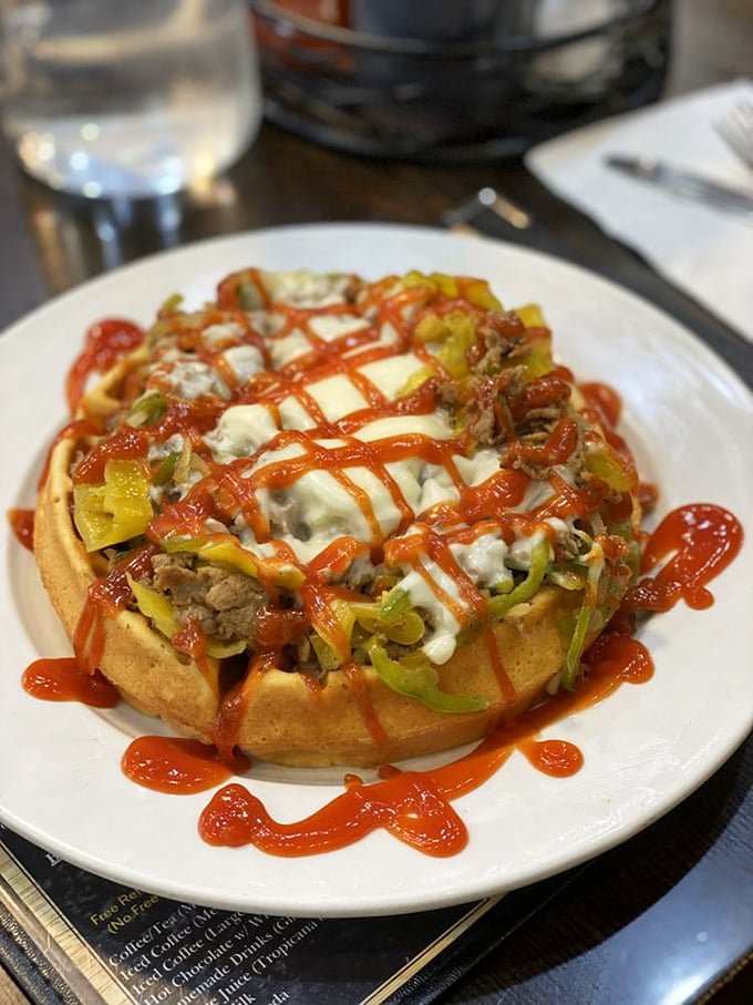 What happens when a waffle and a Philly cheesesteak fall madly in love? This beautiful creation that defies breakfast-lunch boundaries.