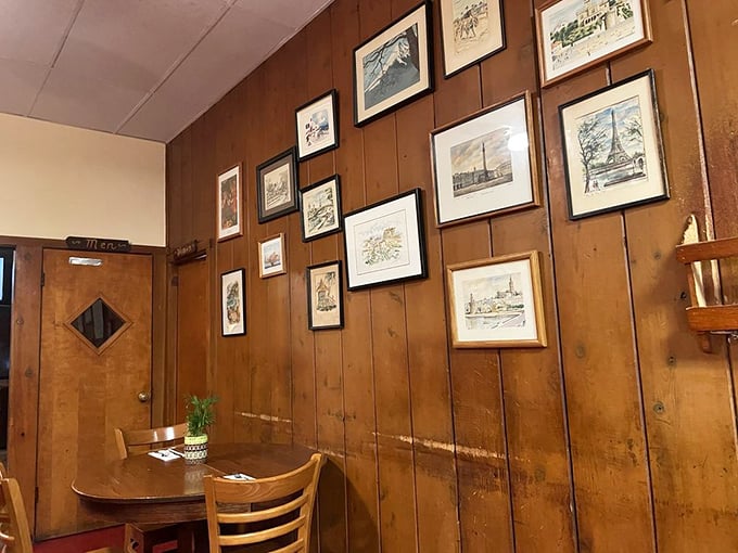 The photo wall serves as a community scrapbook, documenting decades of coastal life in faded frames that tell Pescadero's story.