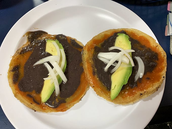 These picadas topped with black bean sauce and avocado are like little edible canvases where tradition meets artistry.