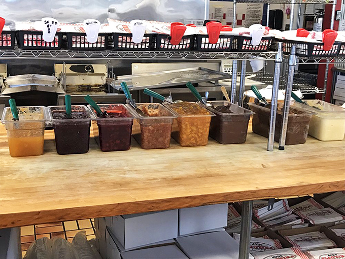 The treasure chest of pie fillings awaits their pastry destiny. Each container holds liquid gold that will transform ordinary dough into extraordinary memories.