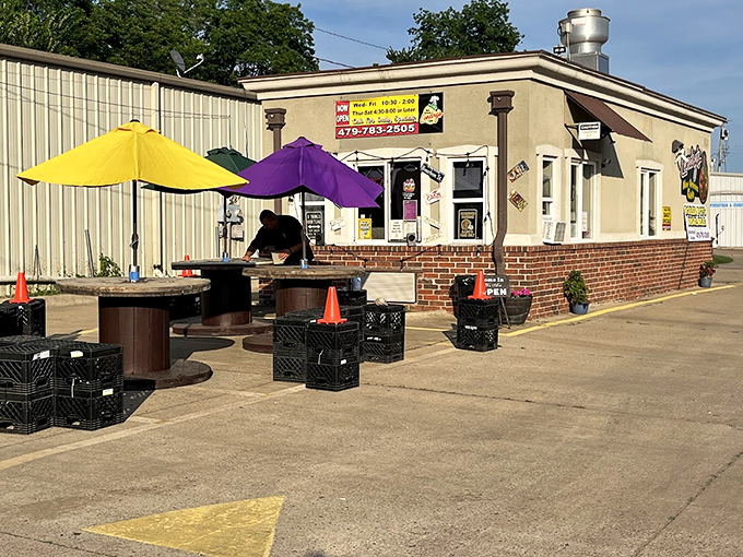 R. Landry's outdoor dining setup proves good food tastes even better under colorful umbrellas. Simple pleasures in unexpected places&mdash;that's small-town charm.
