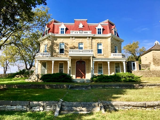 This stately Second Empire-style ranch house, with its distinctive mansard roof, brings unexpected architectural grandeur to the prairie.