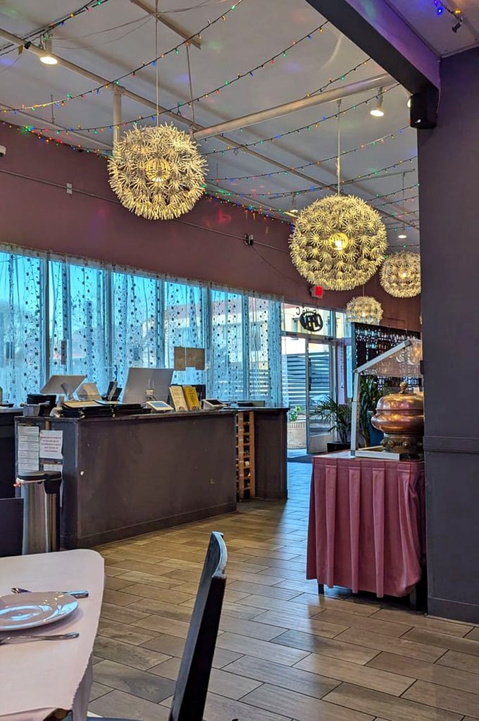 The host stand welcomes you into a world where string lights twinkle overhead and copper pots promise delicious things to come.