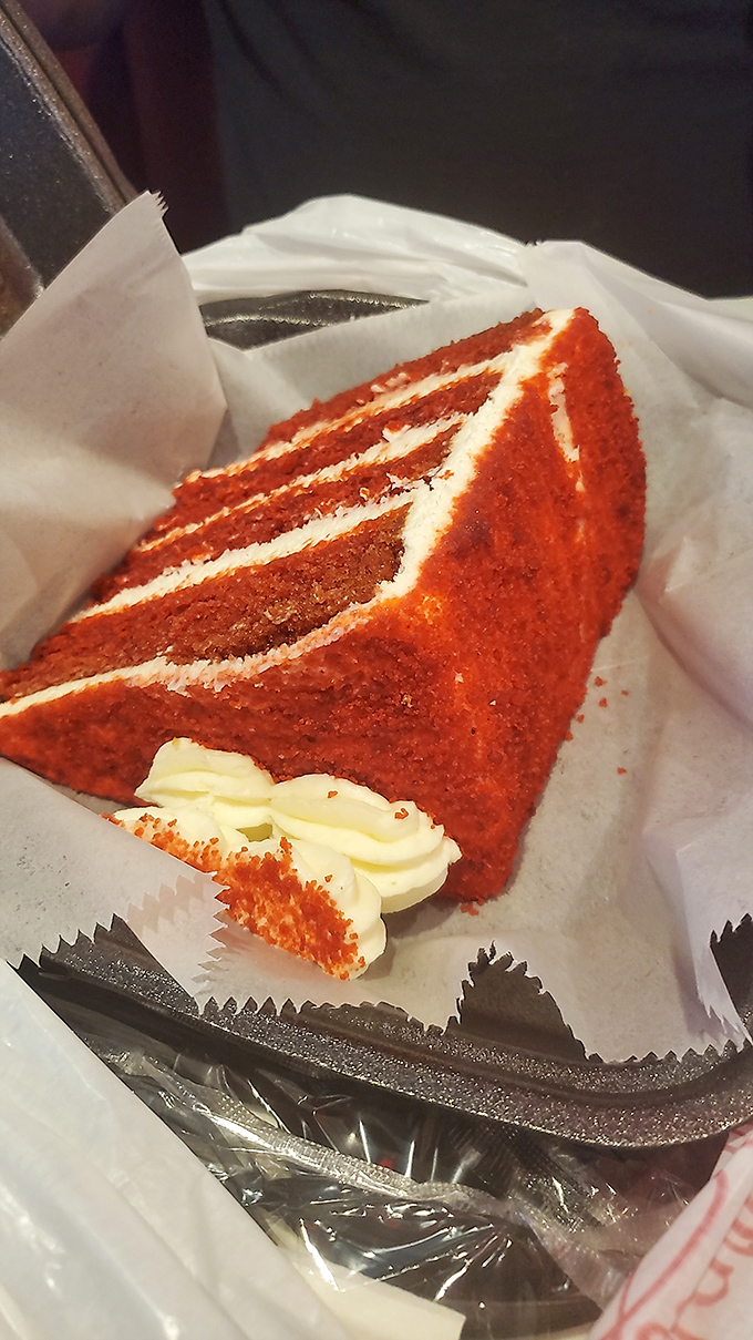 Red velvet cake so vibrant it could stop traffic. Each layer tells a story of butter, love, and someone who really understands dessert.