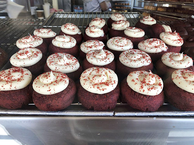 Red velvet donuts topped with cream cheese frosting&mdash;dessert's power couple. They dress up for the occasion while still keeping it casual.