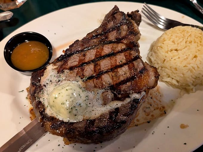 The ribeye arrives with a pool of melted butter and perfect grill marks&mdash;a carnivore's dream that practically dares you to find room for dessert.