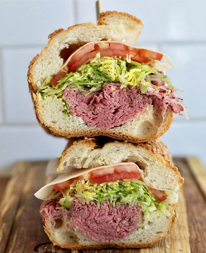 Roast beef so tender it practically surrenders to your bite. The shredded lettuce adds just enough crunch to keep things interesting.