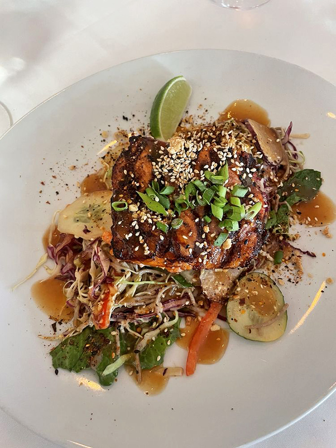 This salmon doesn't just sit on the plate&mdash;it presides over it, wearing a sesame seed tiara and vegetable confetti.