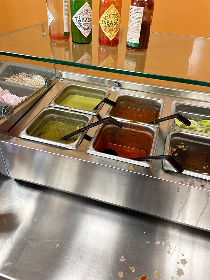 The salsa bar—where relationships are tested and spice tolerance is revealed. Choose wisely, my friends.