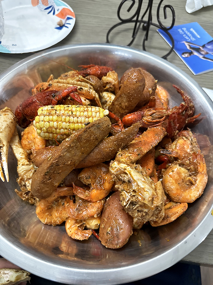 Not just a meal, but a shiny metal mixing bowl of joy. The corn cob is like the drummer in this seafood band—essential but underrated.