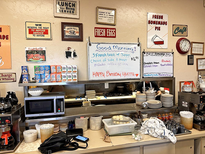 The beating heart of any great diner&mdash;a service counter where magic happens. Note the whiteboard specials and homemade pie signs that whisper sweet promises.