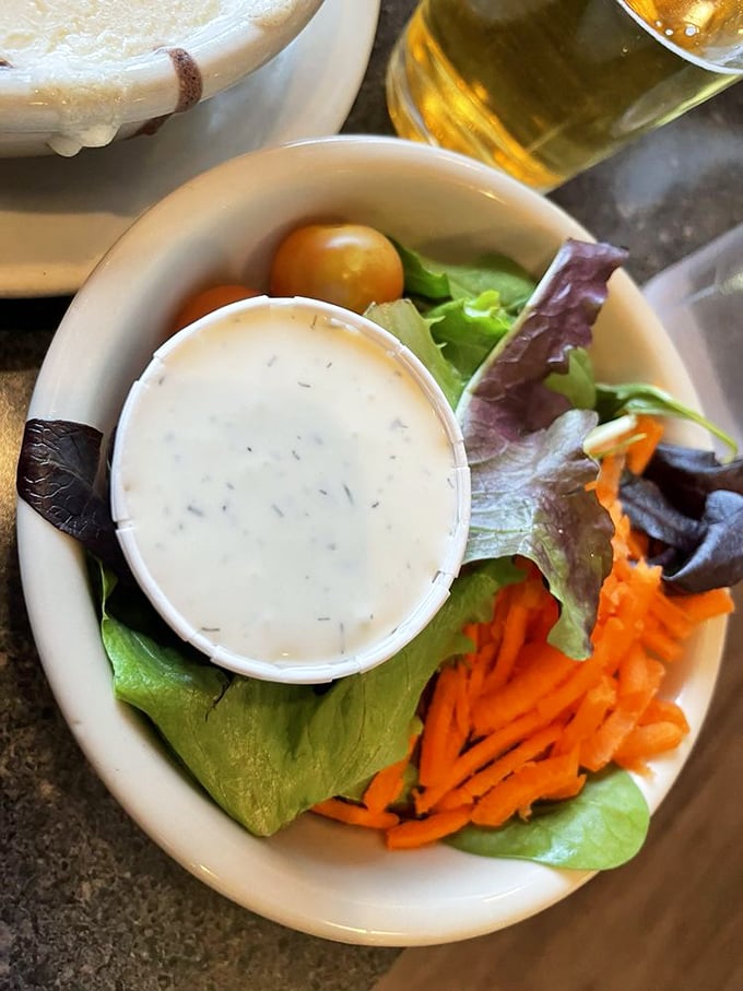 Even the side salad refuses to be forgettable &ndash; crisp greens and shredded carrots dressed with the kind of care usually reserved for main attractions.