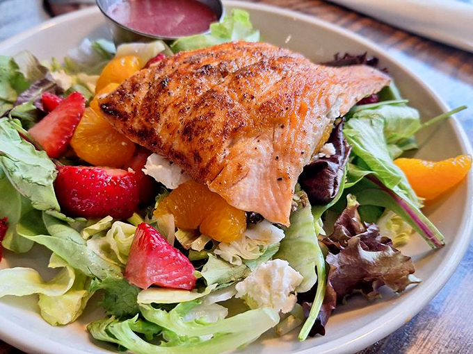 This salmon salad with fresh berries and citrus is what mermaids would eat if they were on a health kick.