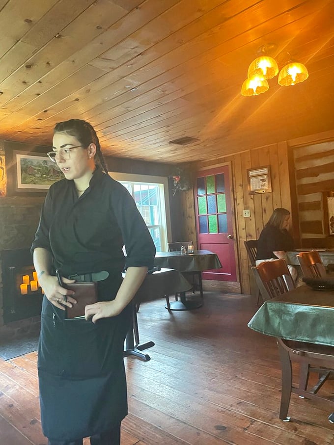 The staff moves through the rustic interior with the confident grace of people who know they're delivering memorable experiences, not just meals.