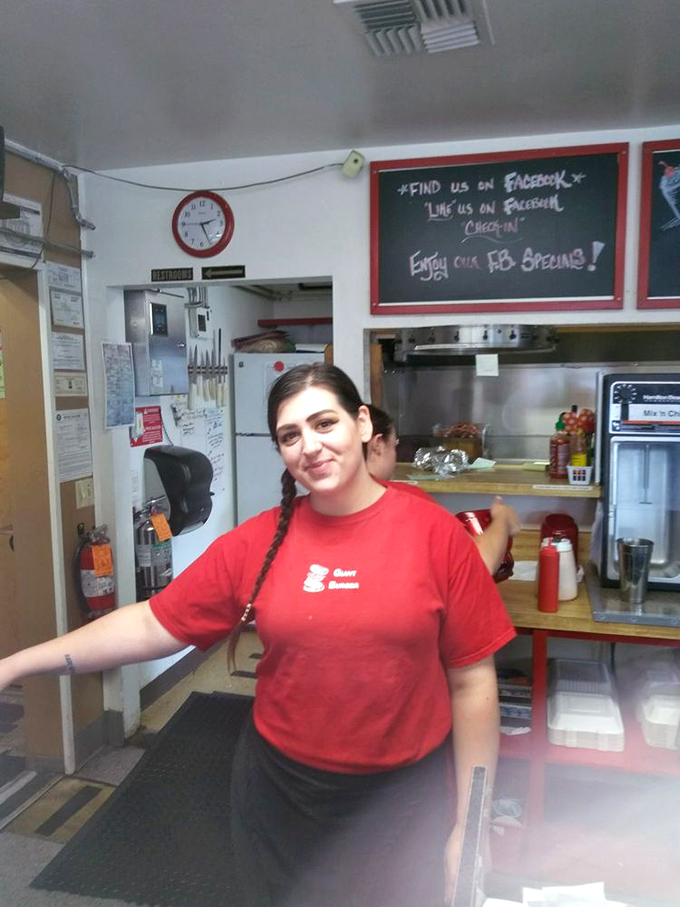 The interior feels like stepping into a time machine &ndash; red vinyl seats and wood paneling create the perfect burger joint ambiance.